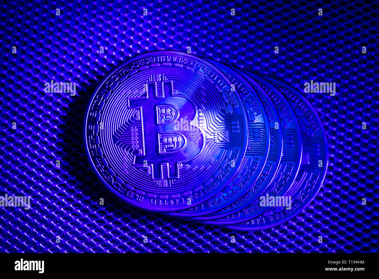 Top view of golden bit coins painted with laser light.Bit coin digital ...