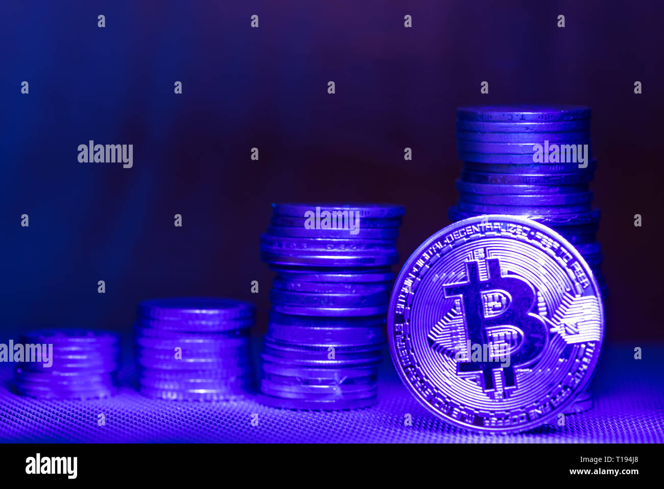 Front view of single golden bit coin painted with laser light.Bitcoin ...