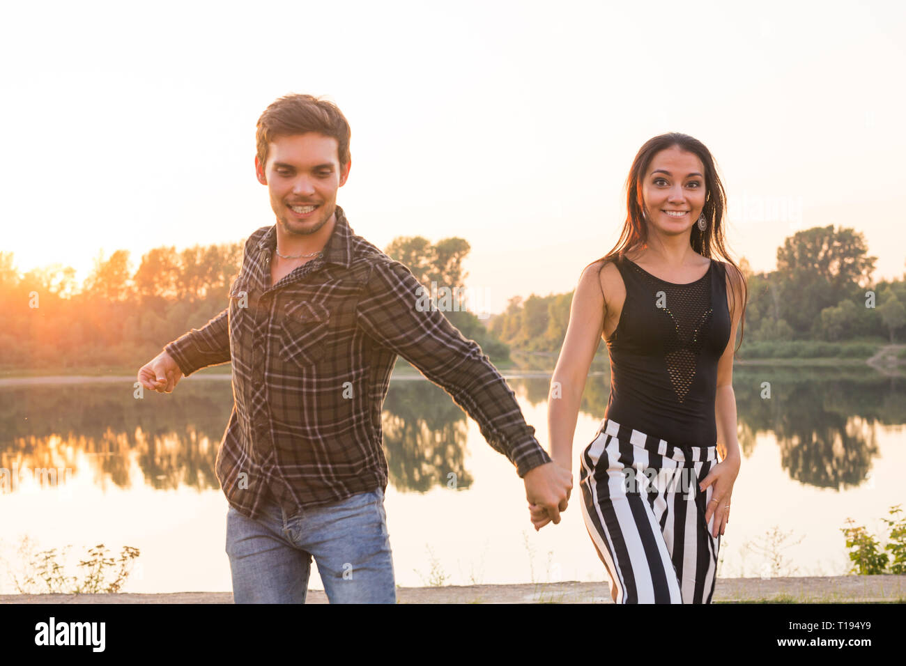 Romantic, social dance and people concept - young couple dancing a ...