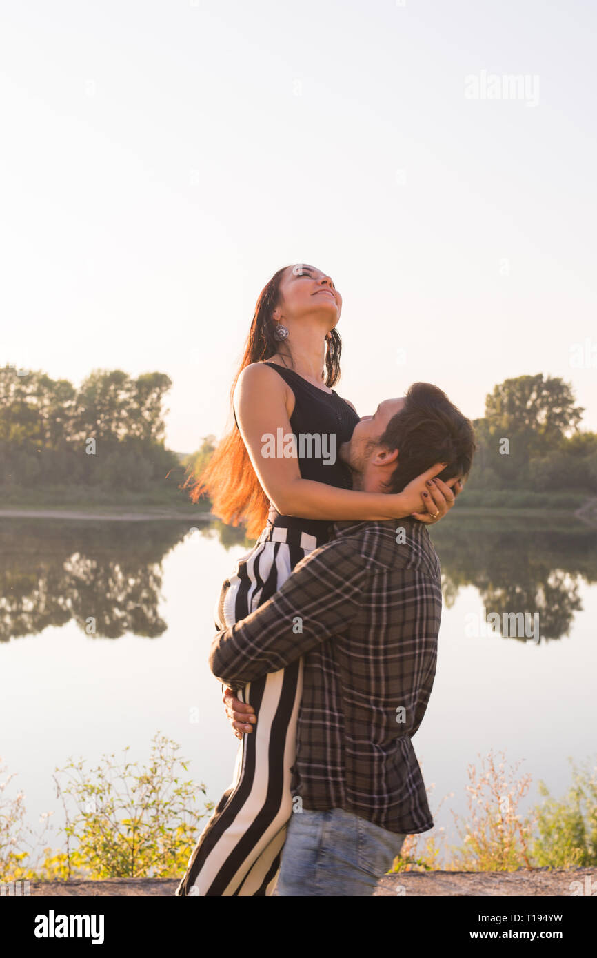 People Love And Nature Concept Man Holding Woman In His Arms Over