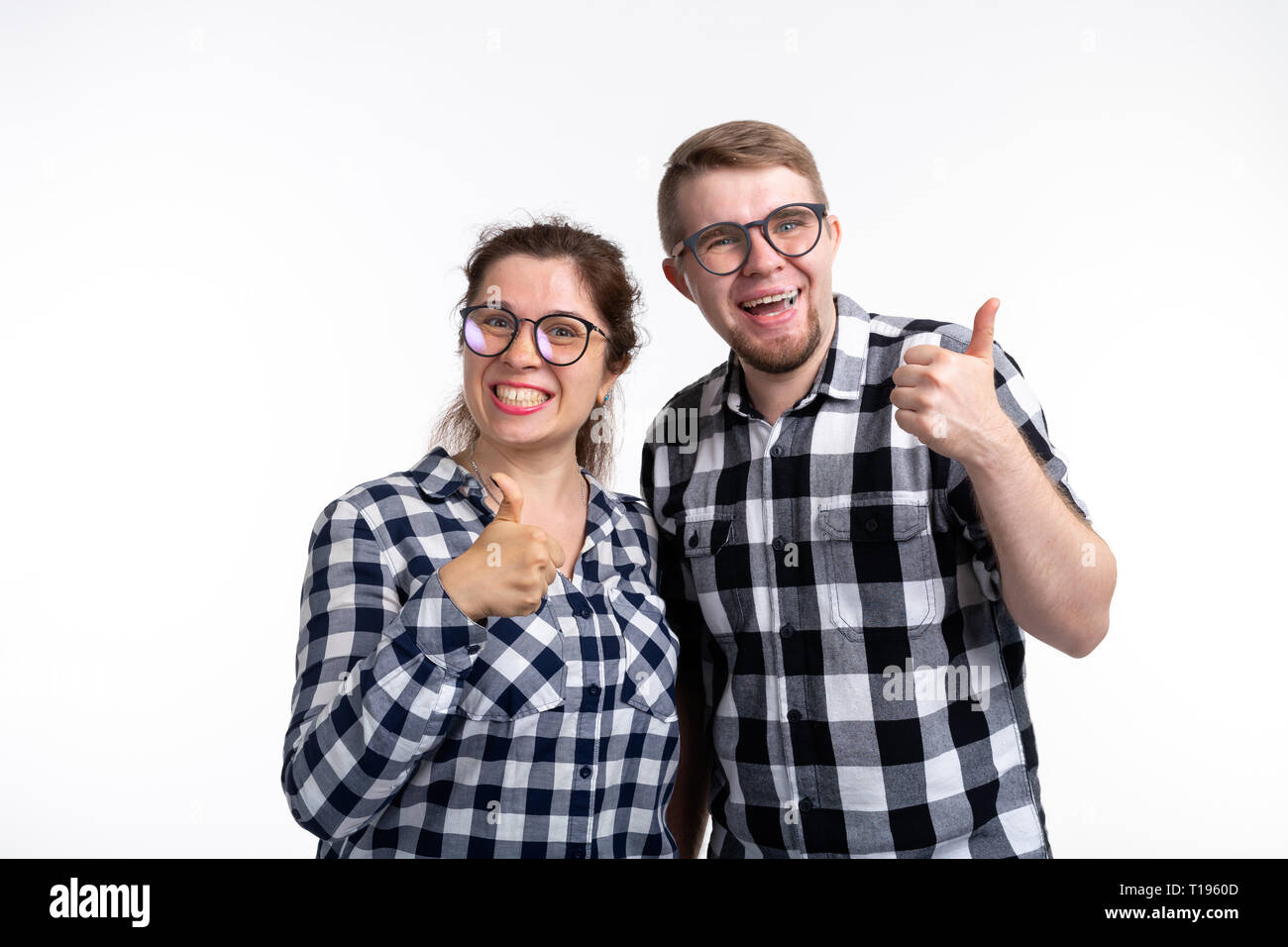 Nerds, geek, bespectacled and funny people concept - a couple of nerds ...