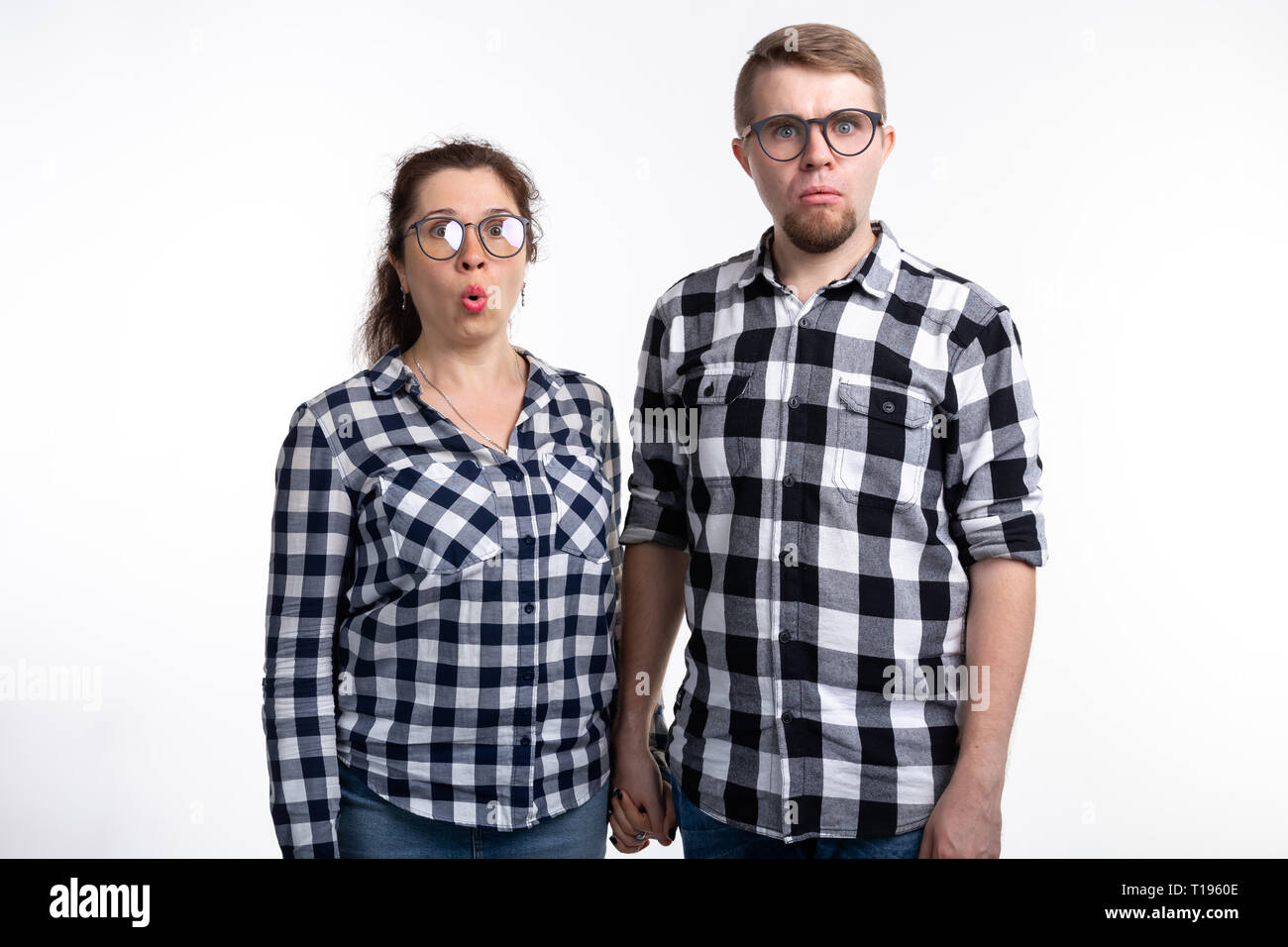 Nerds, geek, bespectacled and funny people concept - a couple of nerds ...