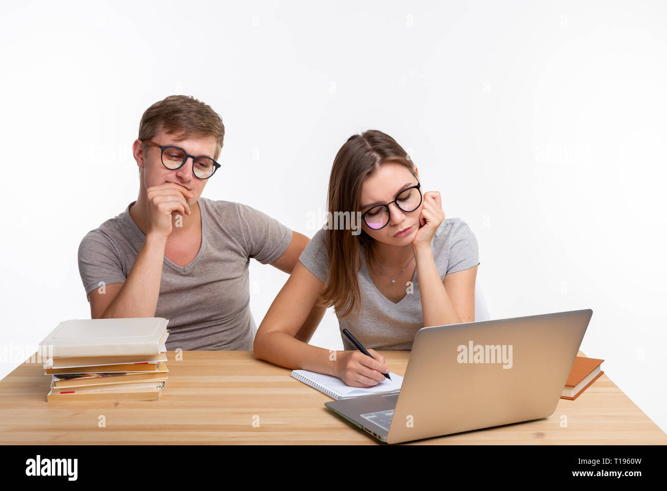 Education, people and relationship concept - a couple of students are ...