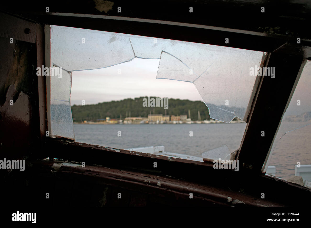View through a broken window of an old ship Stock Photo - Alamy
