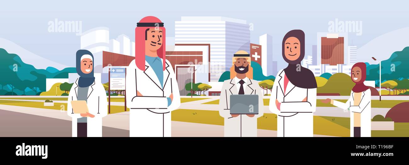 group of arabic doctors team in uniform standing together in front of ...