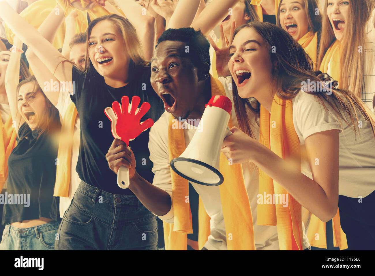 Group of happy fans are cheering for their team victory. Collage made ...