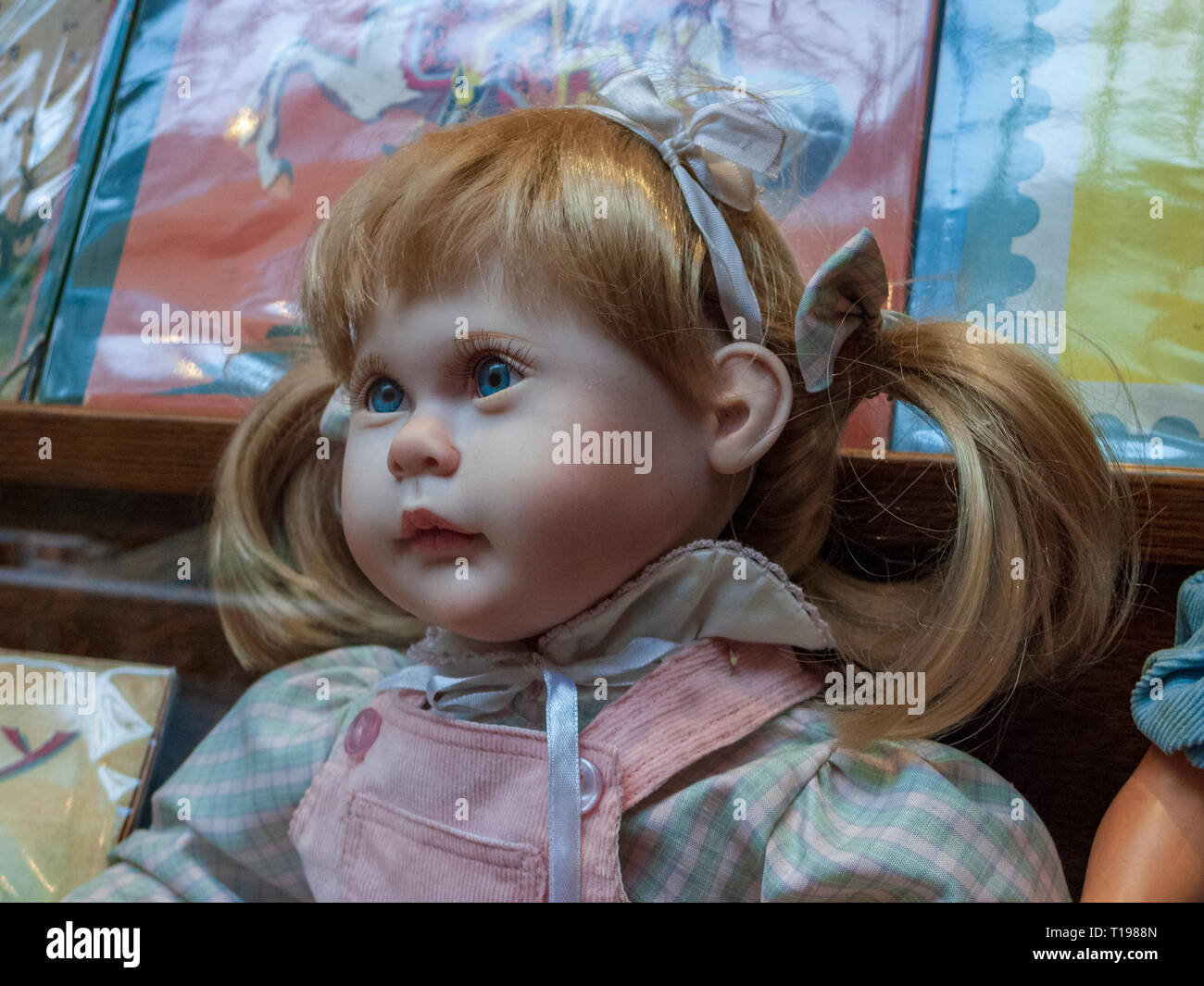 Toy doll is a shop window Stock Photo - Alamy
