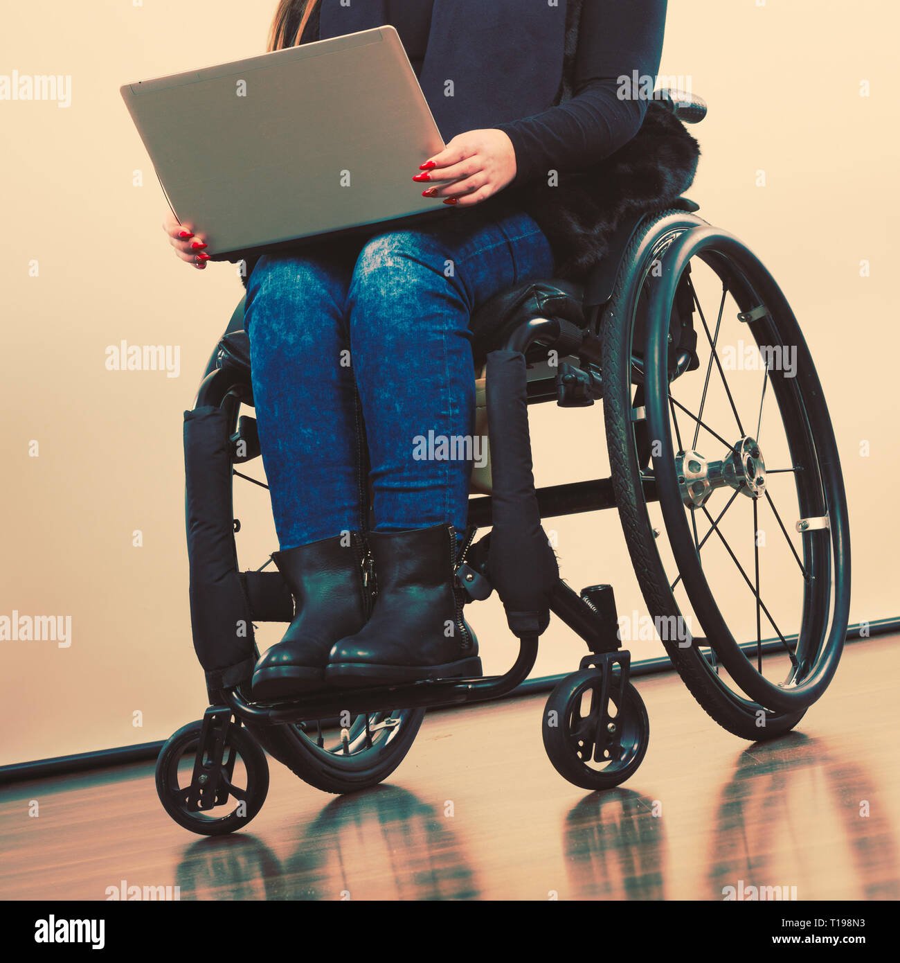 Technology and mobile equipment. Disabled handicapped girl with laptop ...