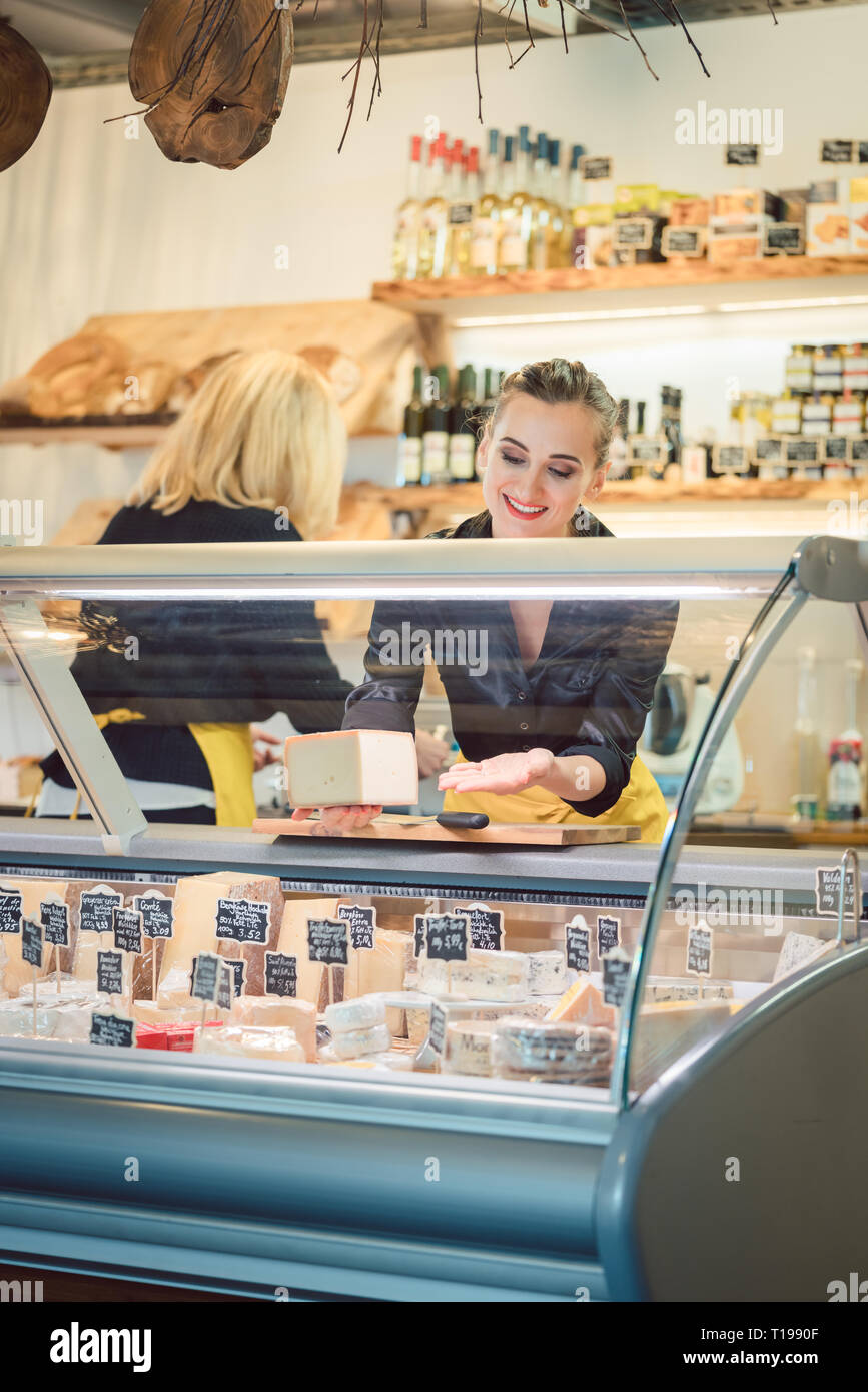 Young Sales lady at the cheese counter in a supermarket Stock Photo - Alamy