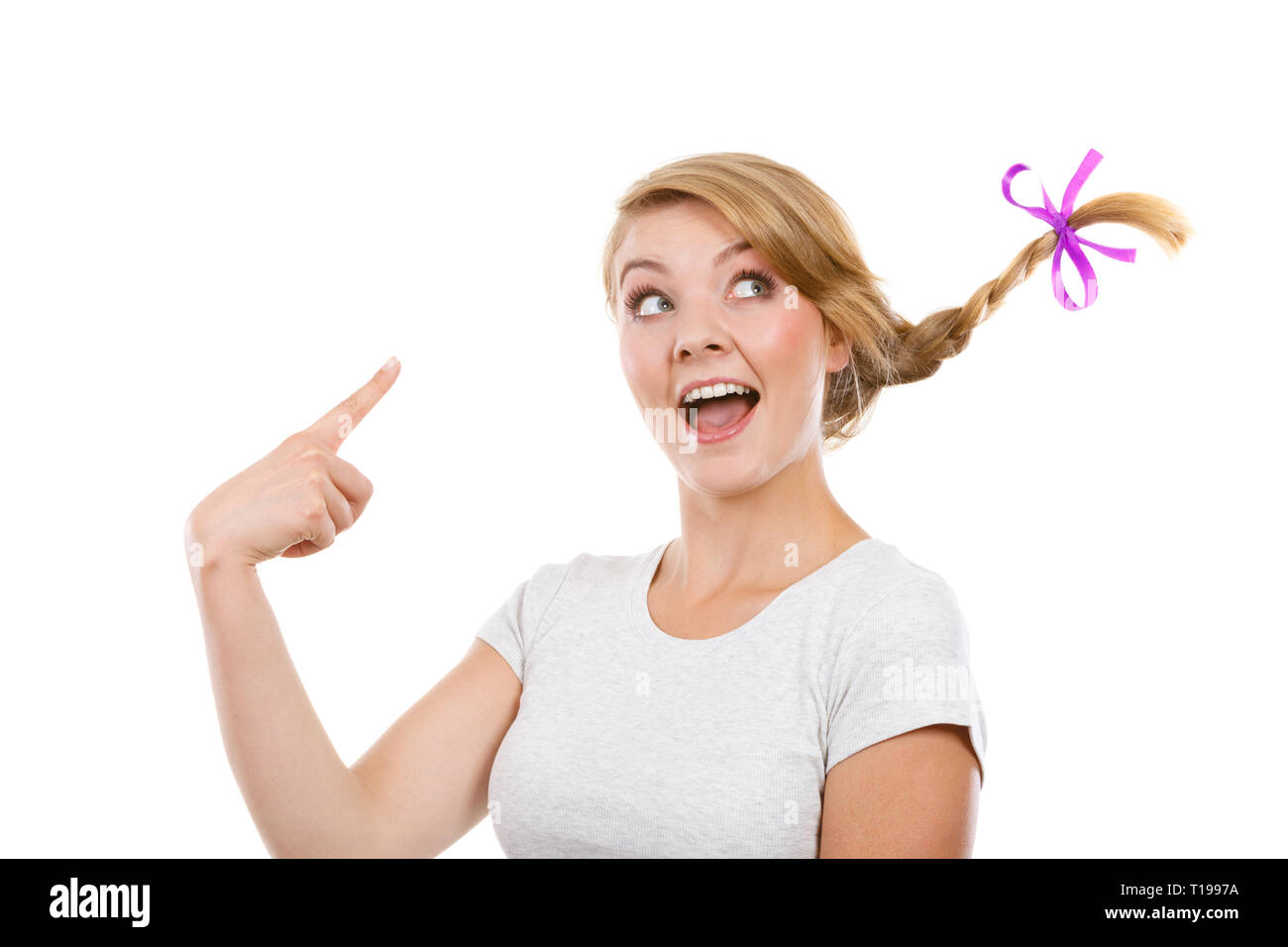 Face expression, happiness concept. Teenage girl in blonde braid ...