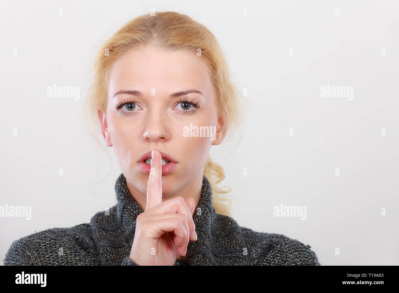 Whisper finger close hi-res stock photography and images - Alamy