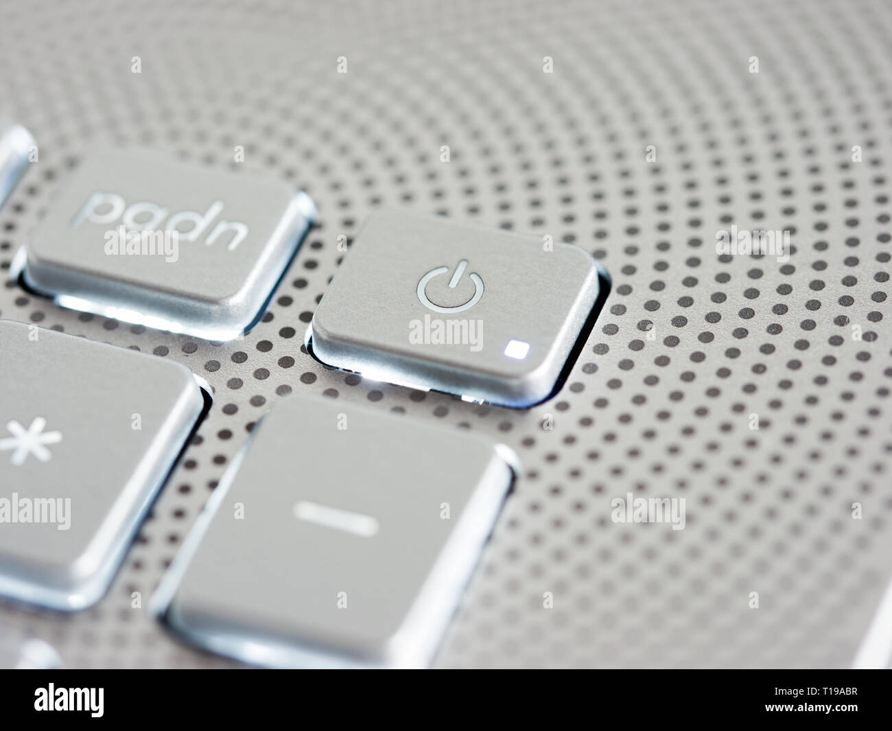 Silver laptop power button close up. Shallow DOF Stock Photo - Alamy