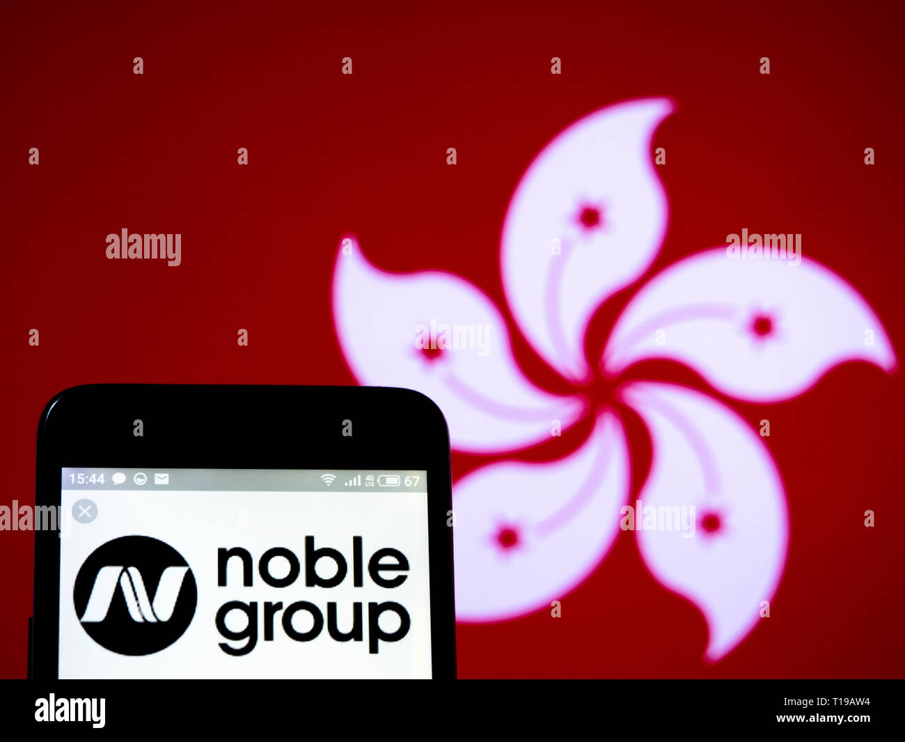 In this photo illustration a Noble Group logo seen displayed on a smart ...