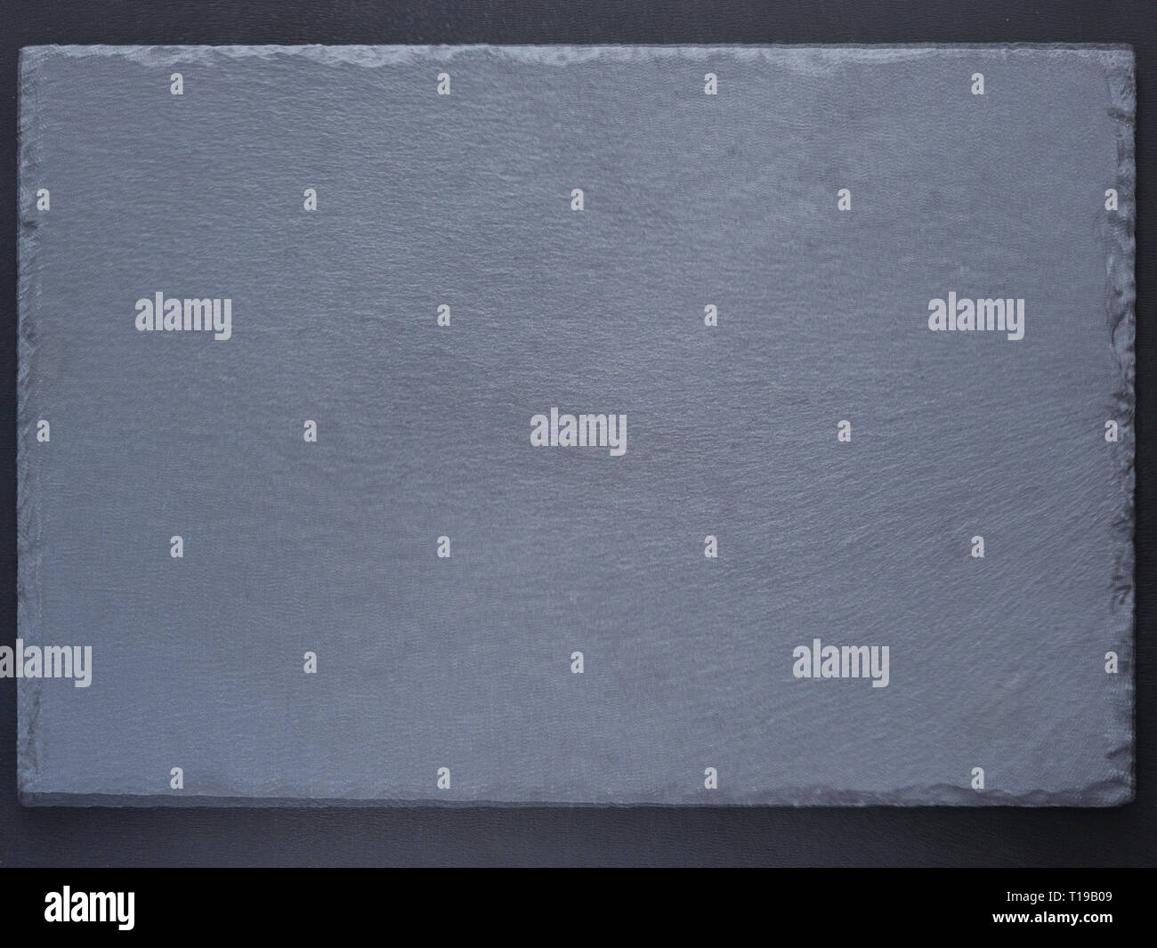 Empty black slate board for serving on dark background. Flat lay or top ...