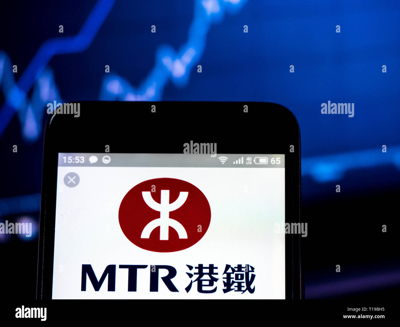 In this photo illustration a MTR Corporation logo seen displayed on a ...