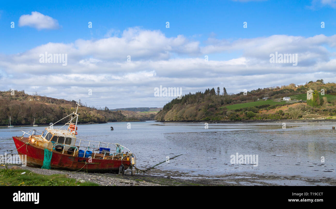 shipwreck on the mud flats at low tide in Castlehaven Harbour West Cork ...
