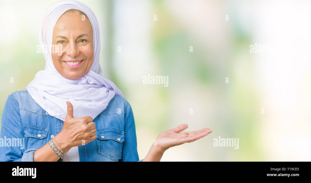 Middle age eastern arab woman wearing arabian hijab over isolated ...