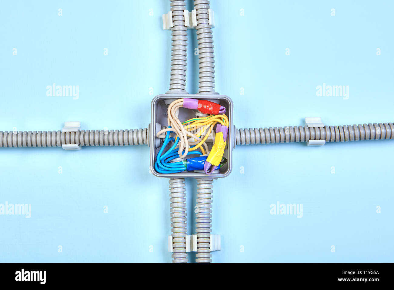 Installing surface mounted wiring, junction box with copper wires with ...