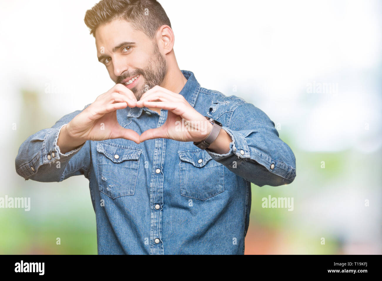 Young handsome man over isolated background smiling in love showing ...