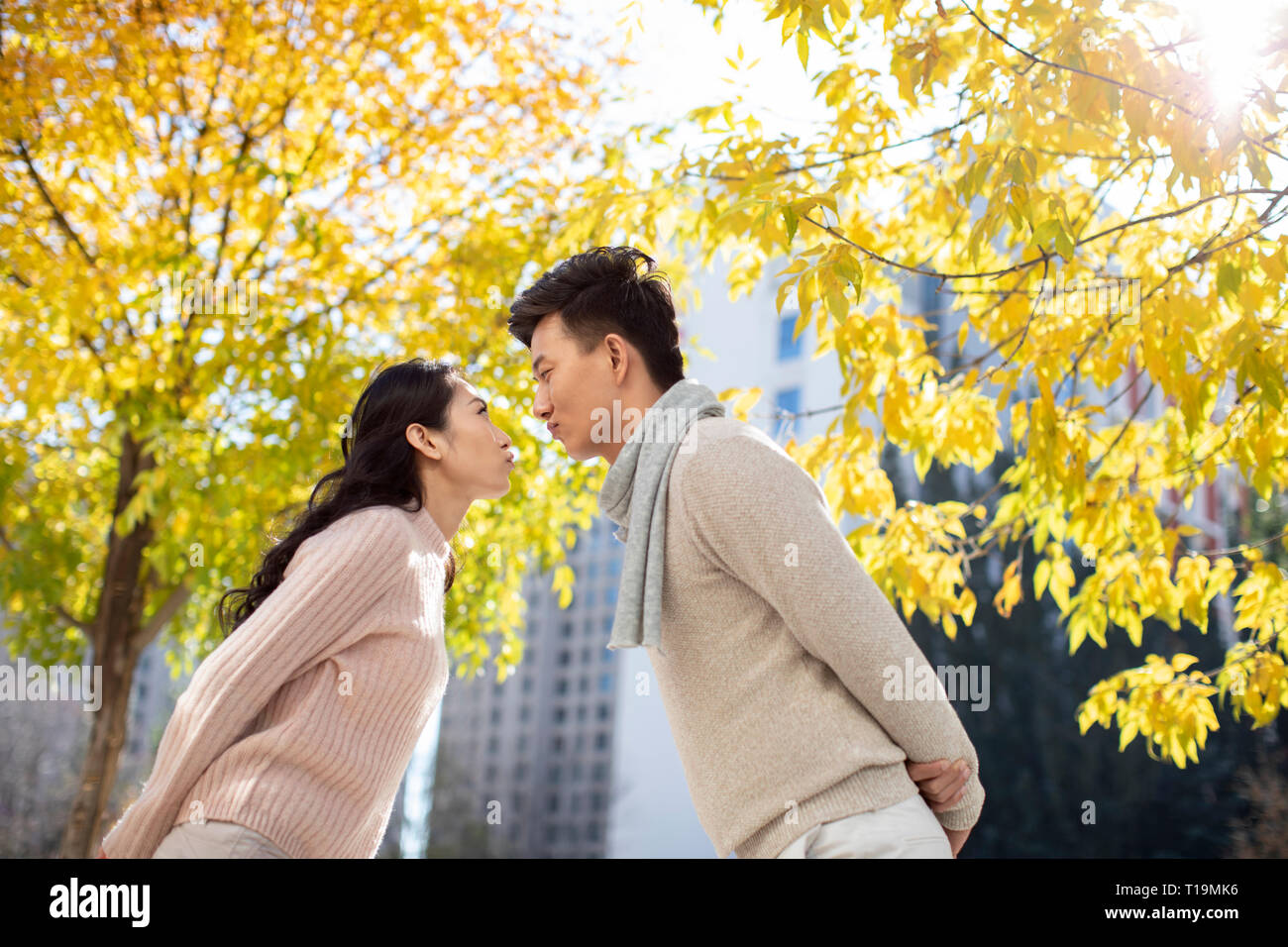 Happy young couple dating in autumn Stock Photo - Alamy