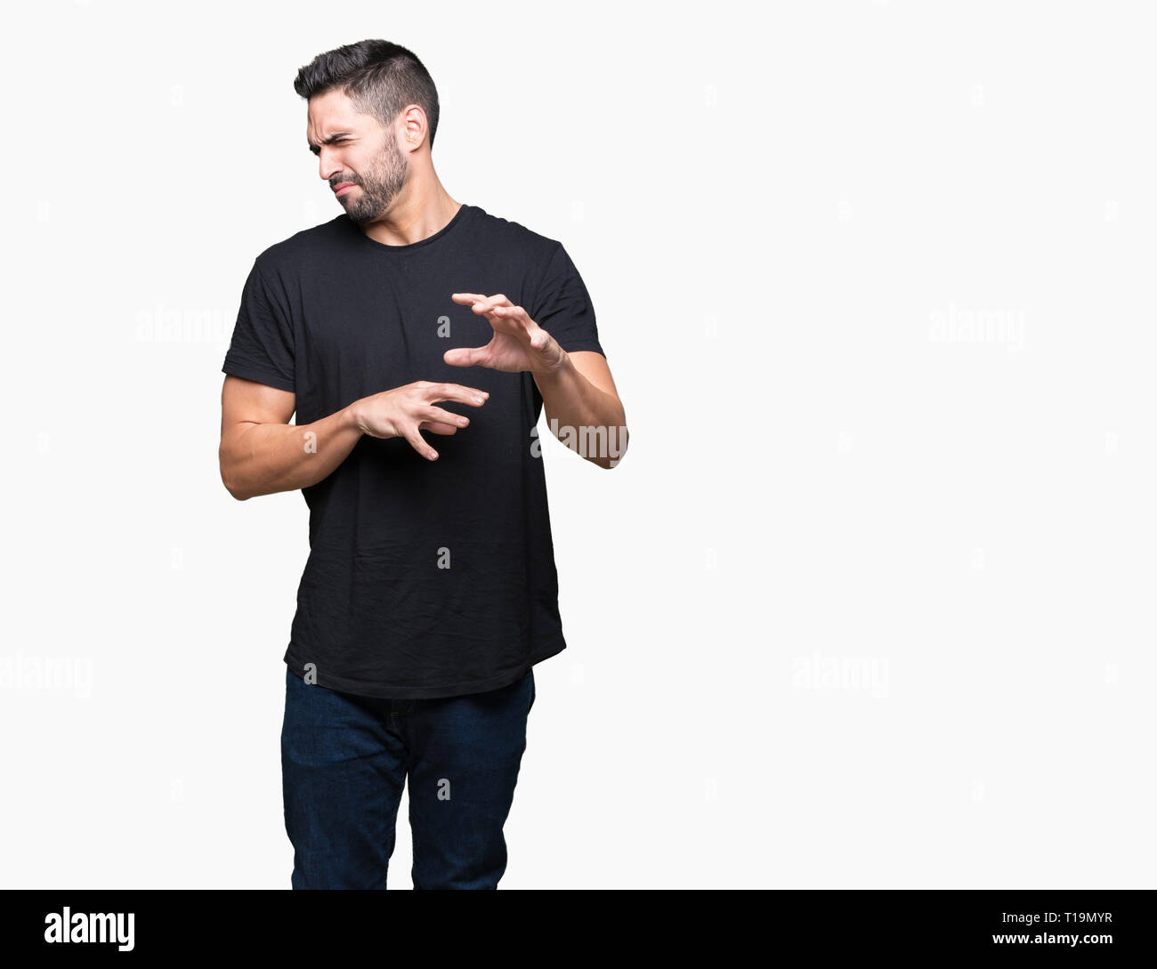 Young handsome man over isolated background disgusted expression ...