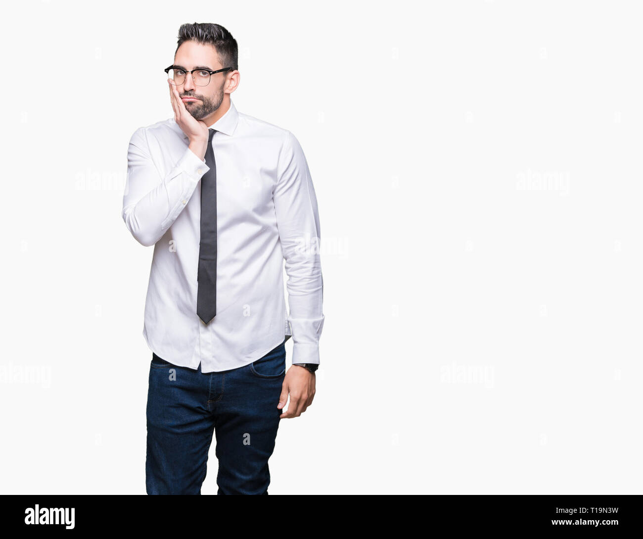 Young handsome business man wearing glasses over isolated background ...