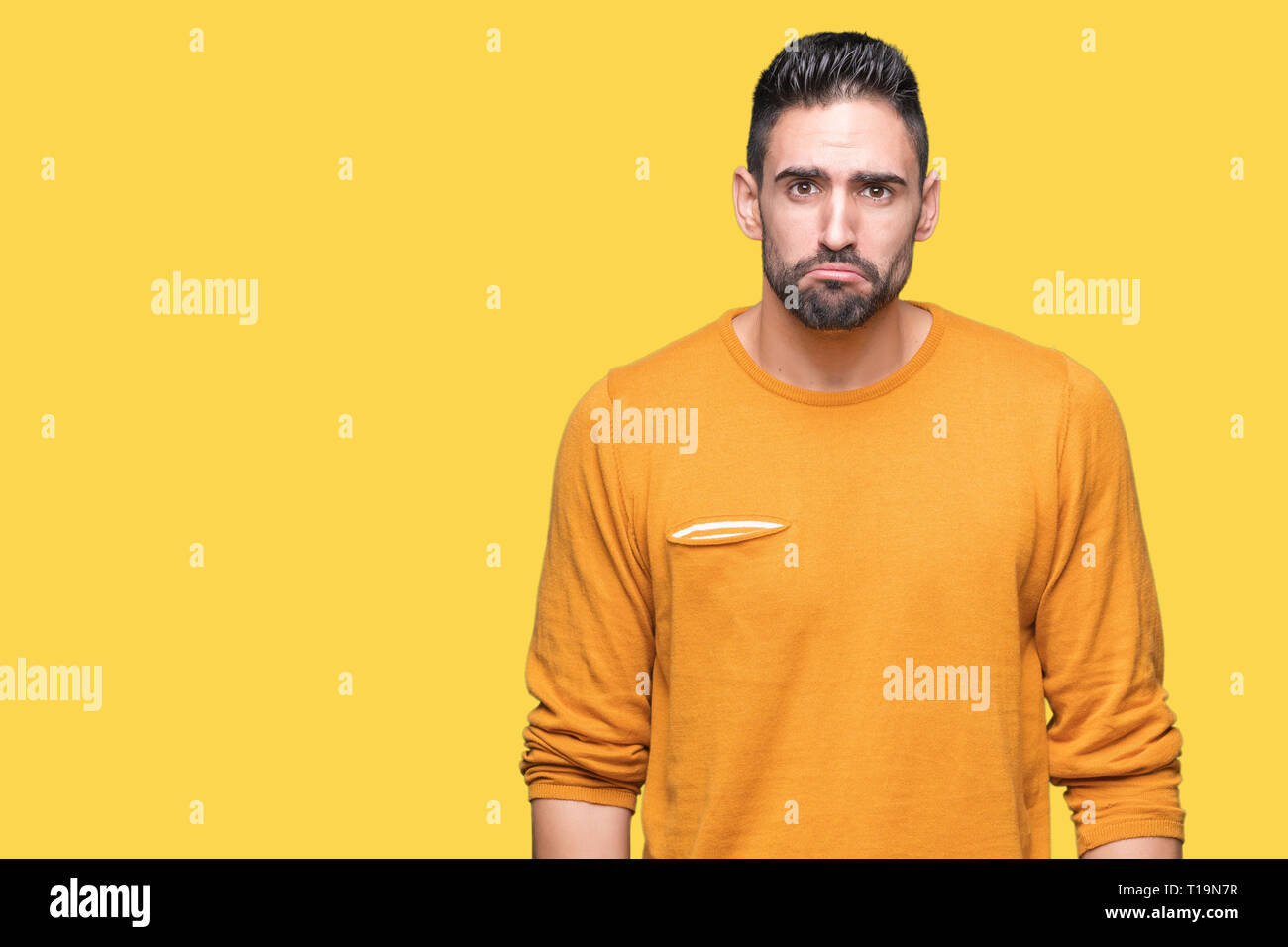 Young handsome man over isolated background depressed and worry for ...