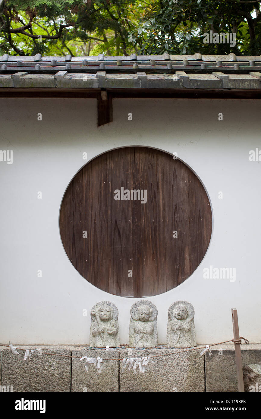 Side view of temple in Arashiyama district of Kyoto with statues and ...
