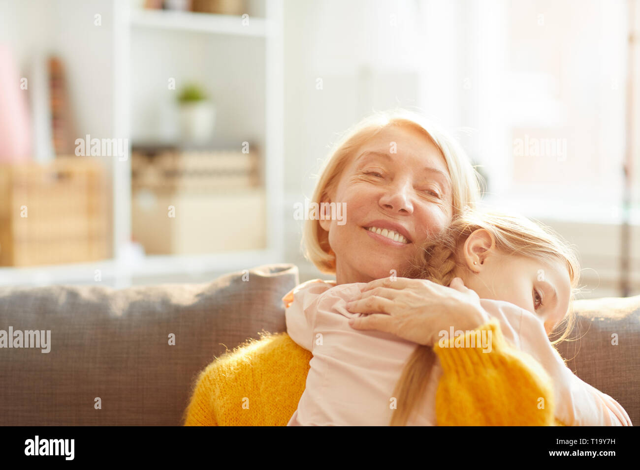 Caring Mother Embracing Child Stock Photo - Alamy