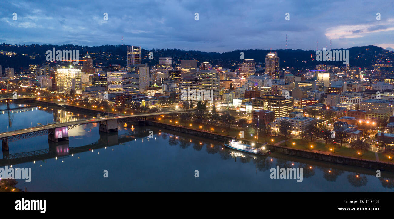 The city skyline glows at dusk in this aerial view of Portland Oregon ...