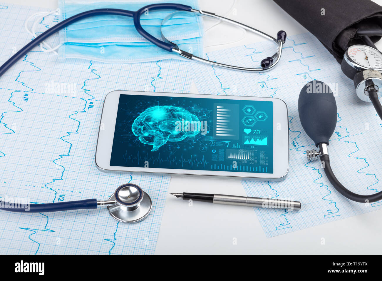 Brain functionality report with medical devices around Stock Photo - Alamy