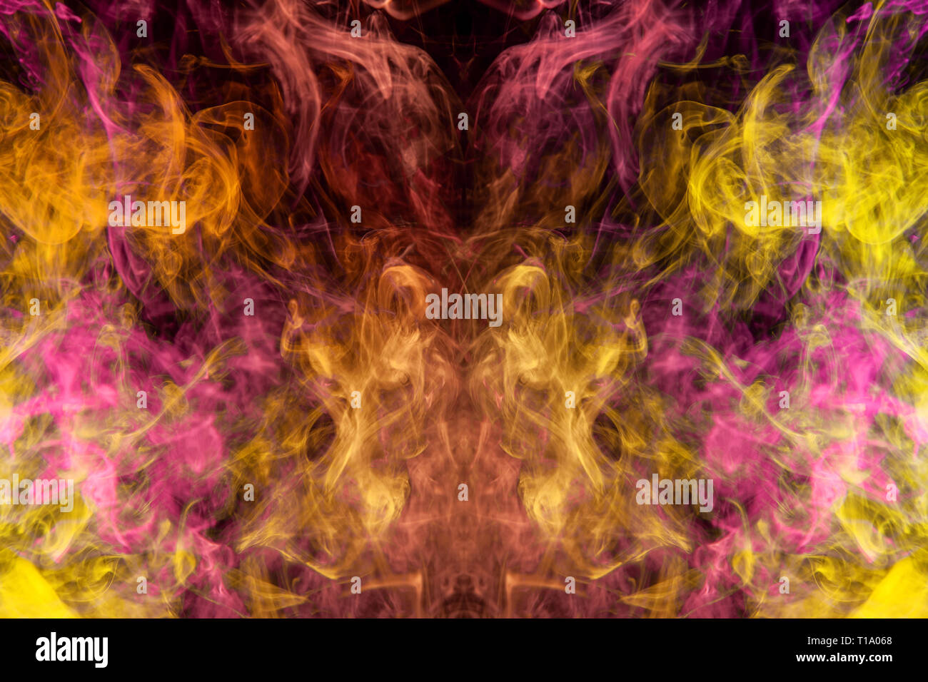 Cloud of yellow and pink smoke in the form of a skull, monster, dragon ...