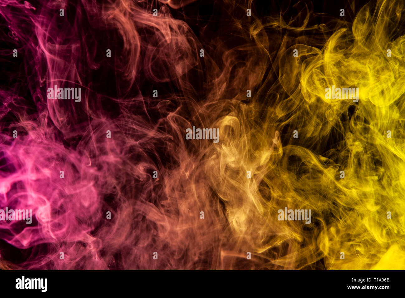 Frozen abstract movement of explosion yellow and pink smoke multiple ...