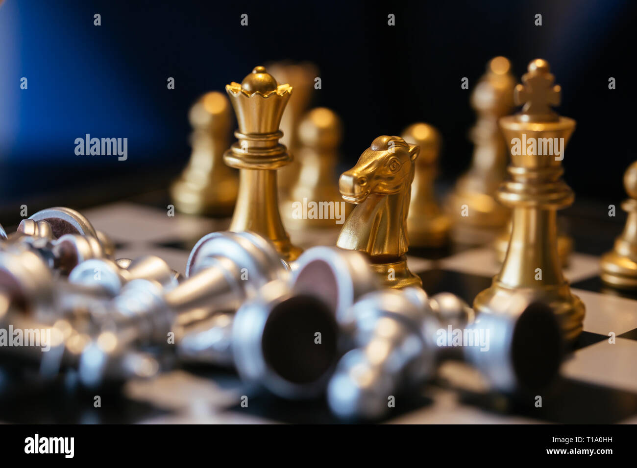 Golden chess pieces hi-res stock photography and images - Alamy