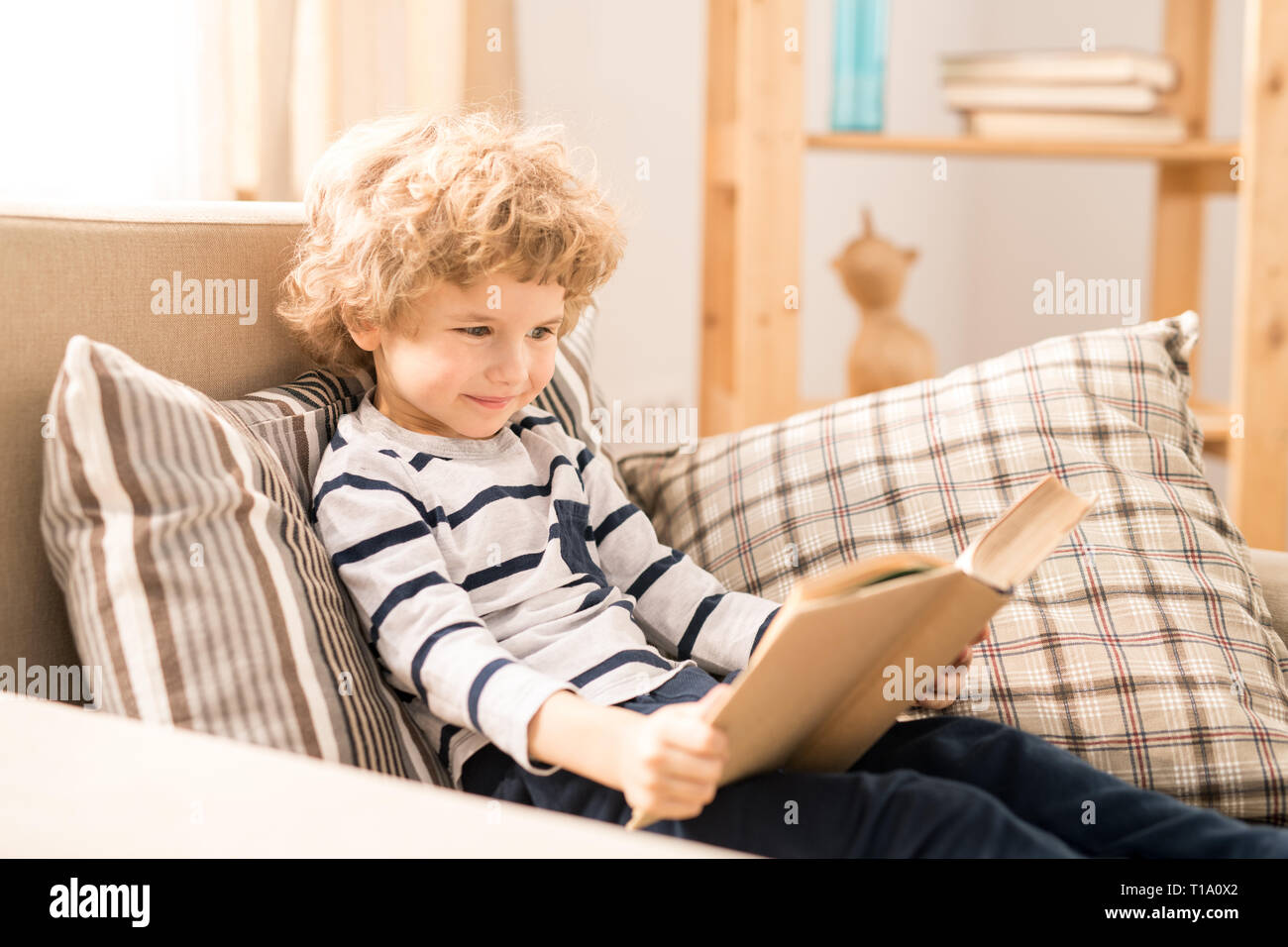 Cute little reader Stock Photo - Alamy