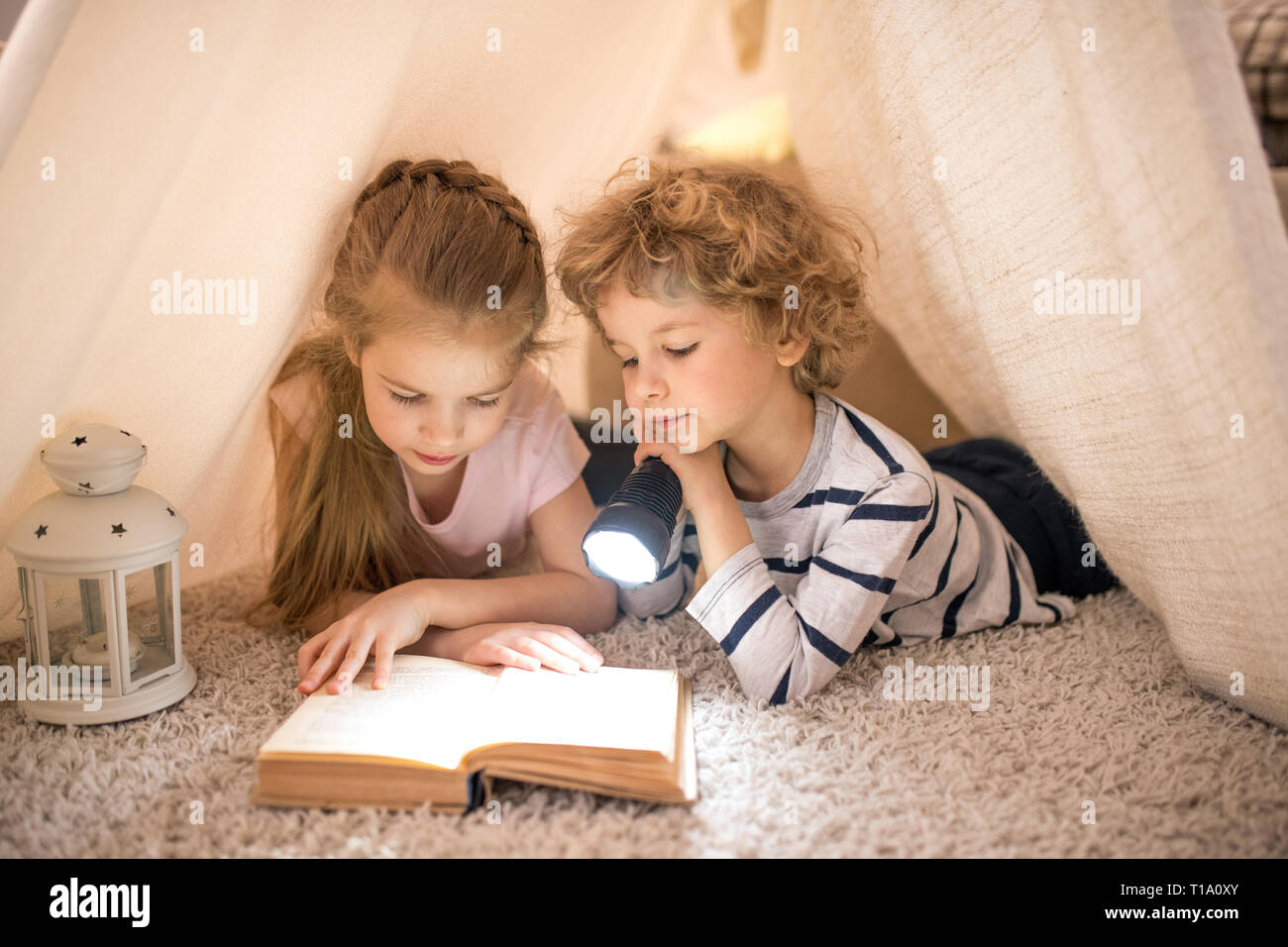 Reading fairy tales Stock Photo - Alamy
