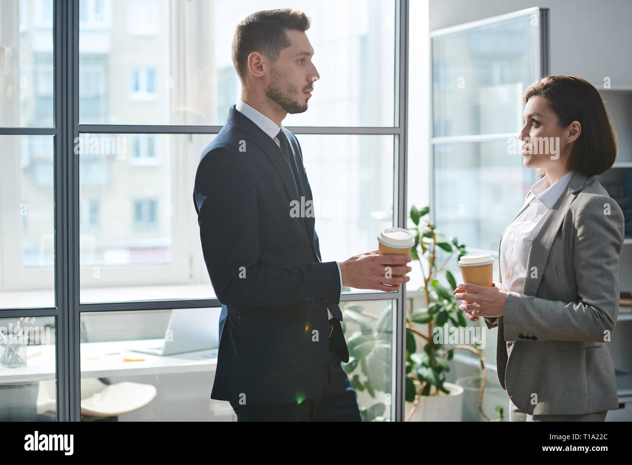 Conversation at coffee-break Stock Photo - Alamy
