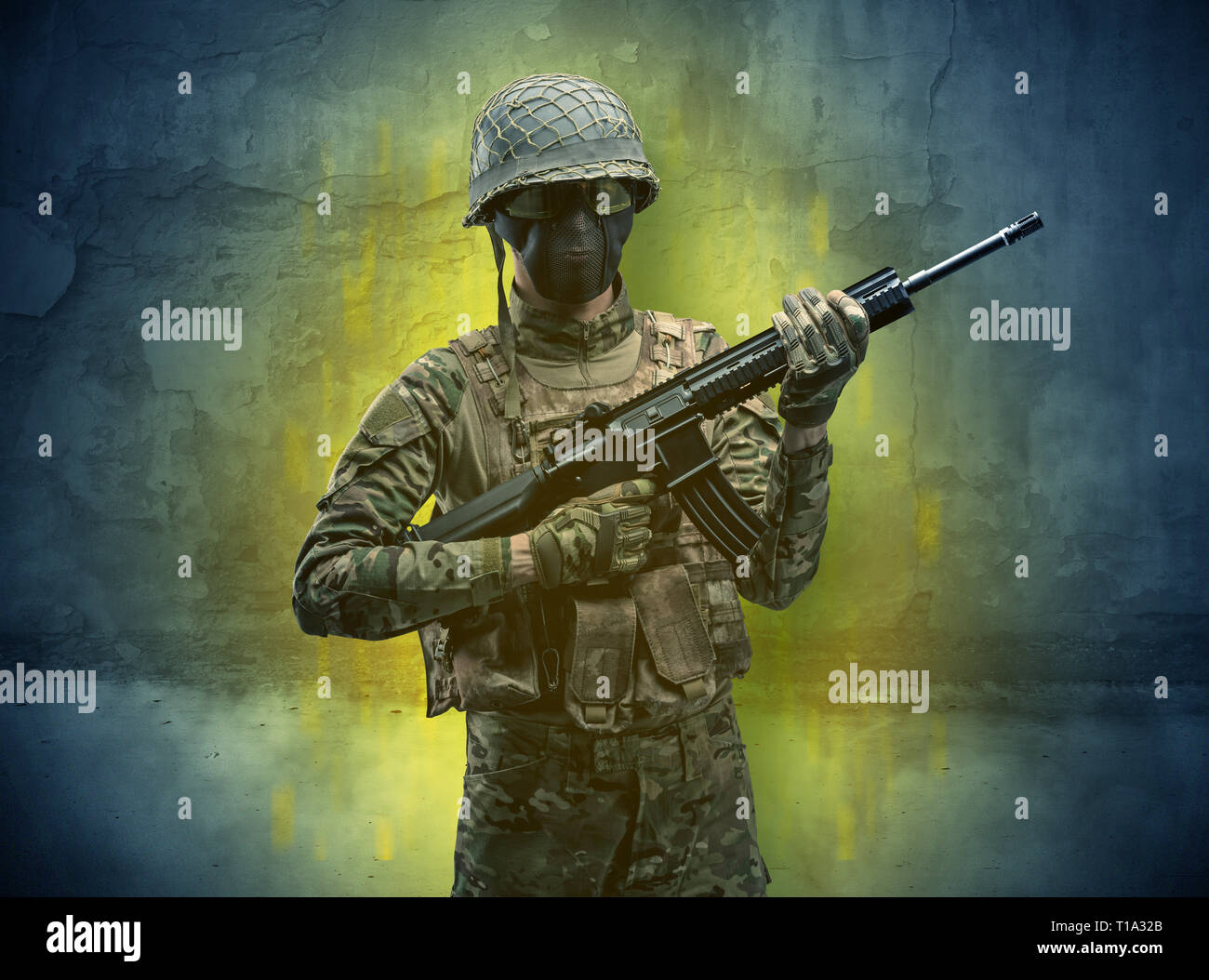 Hazard, menace soldier in a ruined crumbly building with arms on his ...