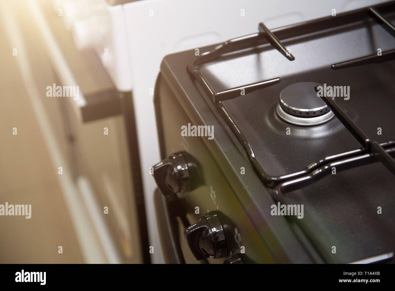 Closeup clean new kitchen gas stove cooker knob heat volume switch ...