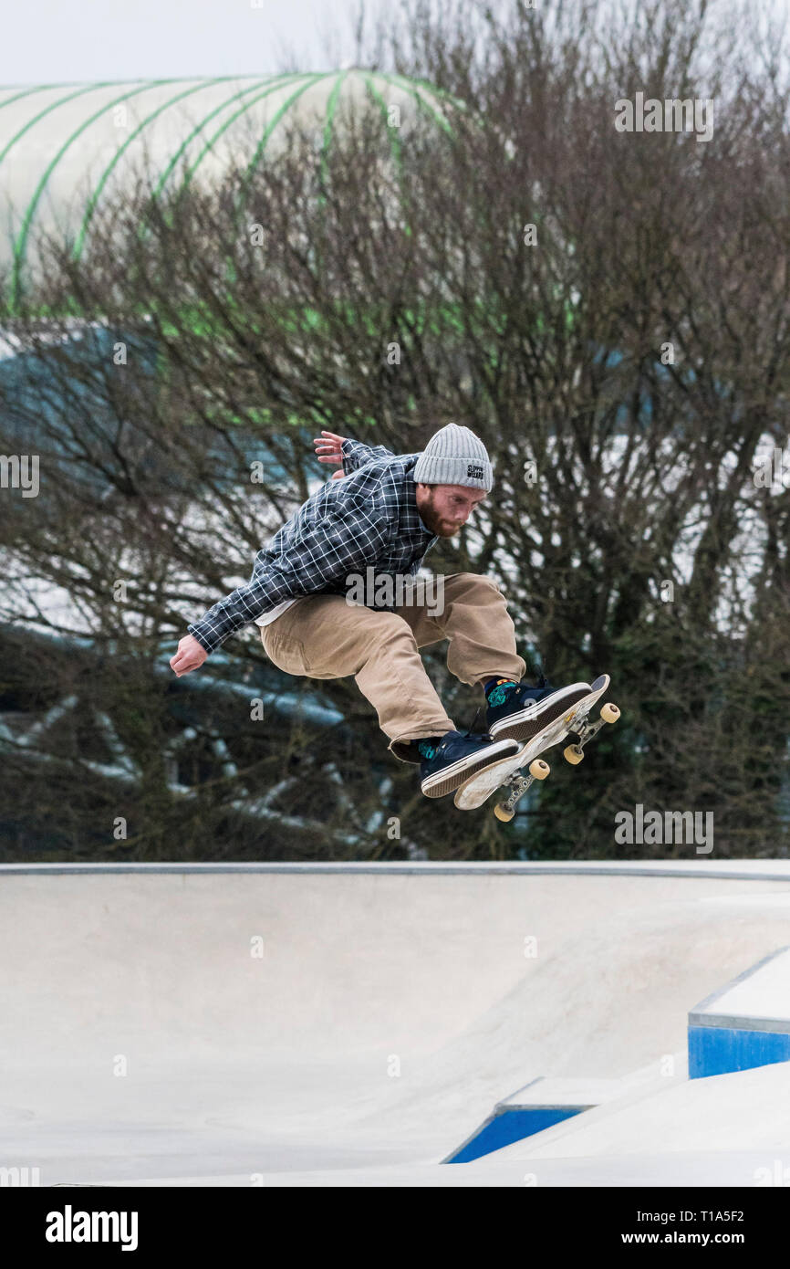 A skateboarder performing an aerial trick at Concrete Waves Skateboard ...