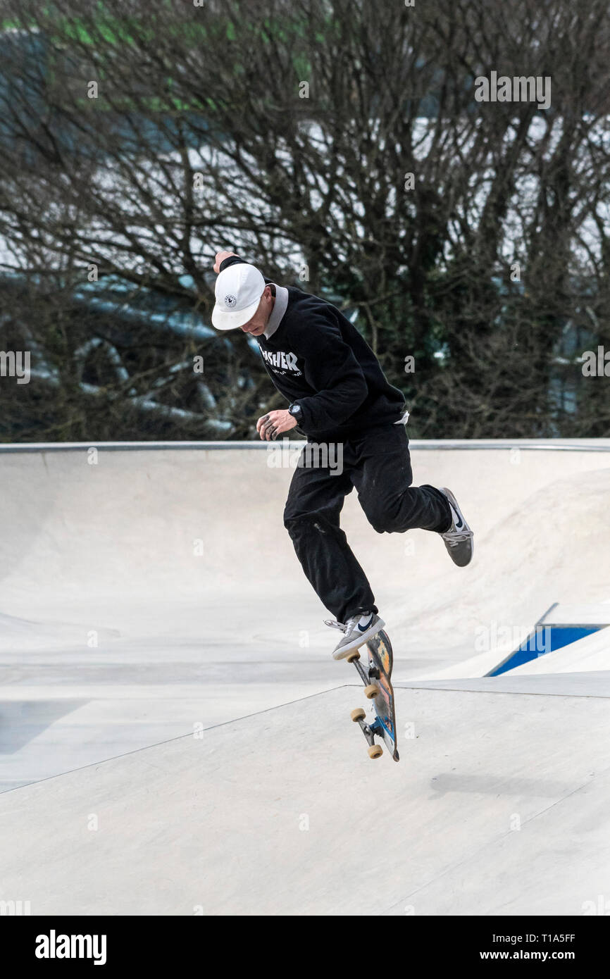 A skateboarder attempting to perform an aerial trick at Concrete Waves ...