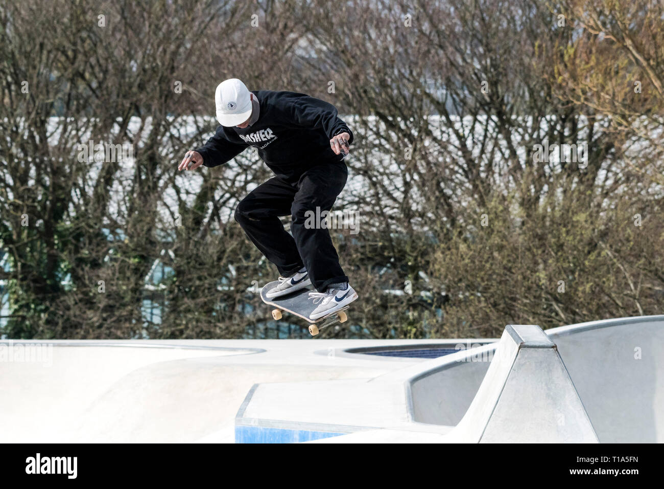 A skateboarder performing an aerial trick at Concrete Waves Skateboard ...