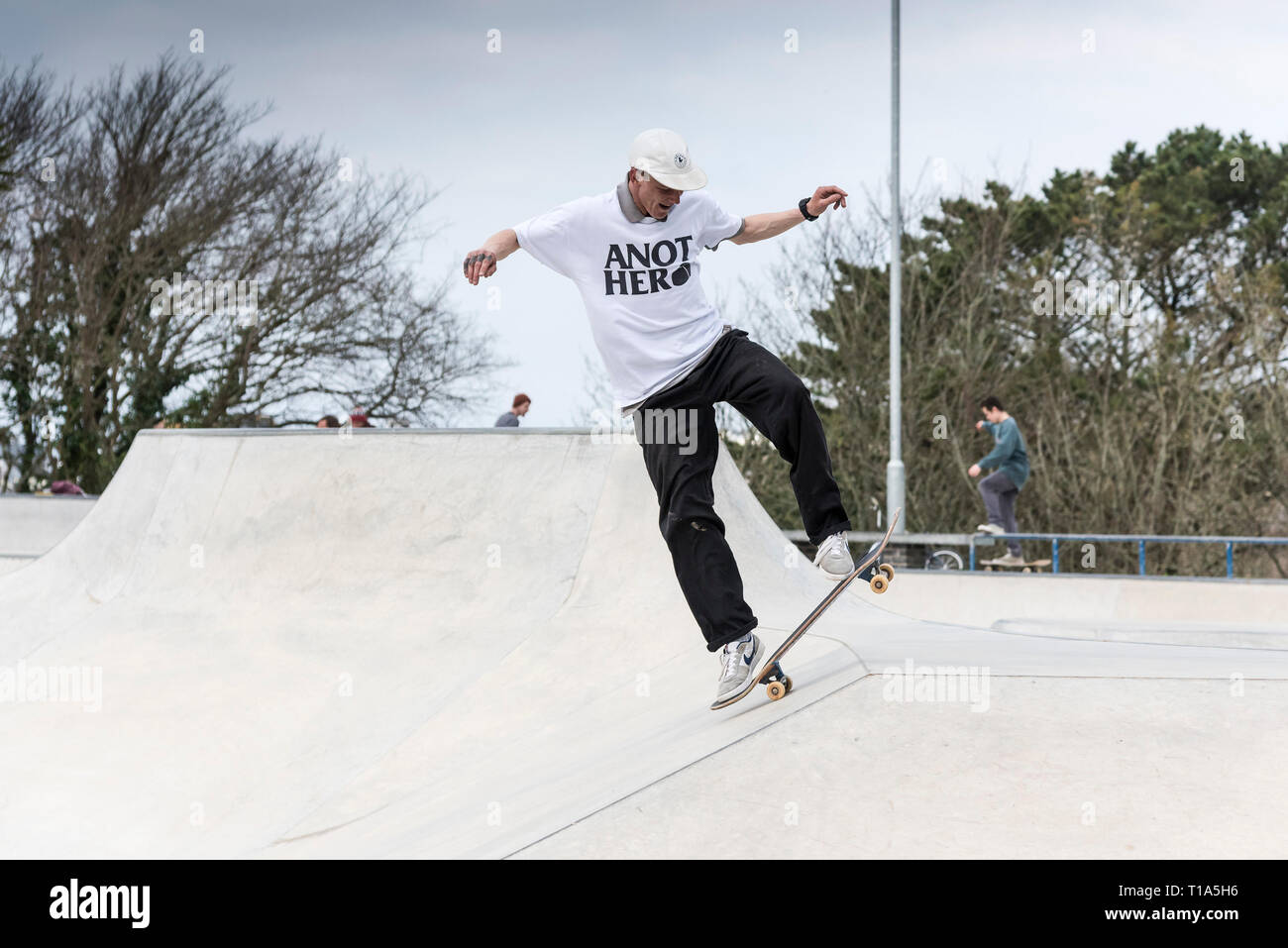 A skateboarder performing an aerial trick at Concrete Waves Skateboard ...