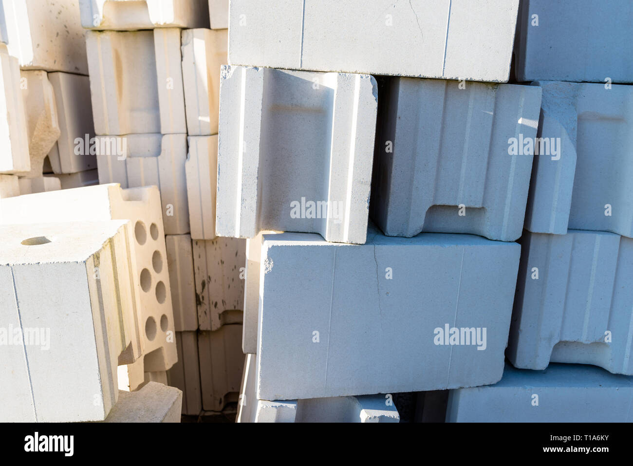 Heap of bricks from cellular concrete, white bricks, hollow bricks with ...