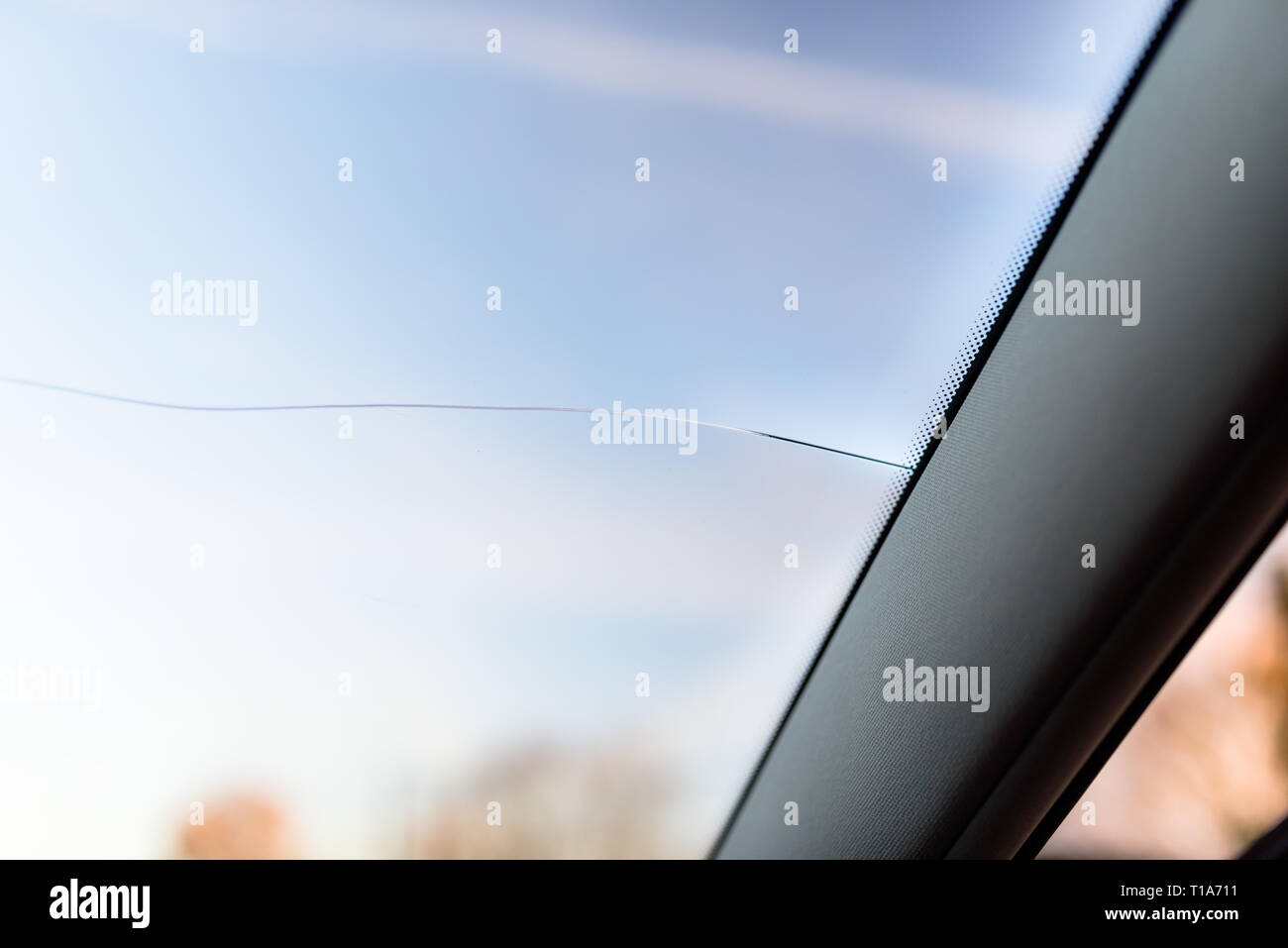 A long rupture of the windshield in the car, from the cars pillar to ...
