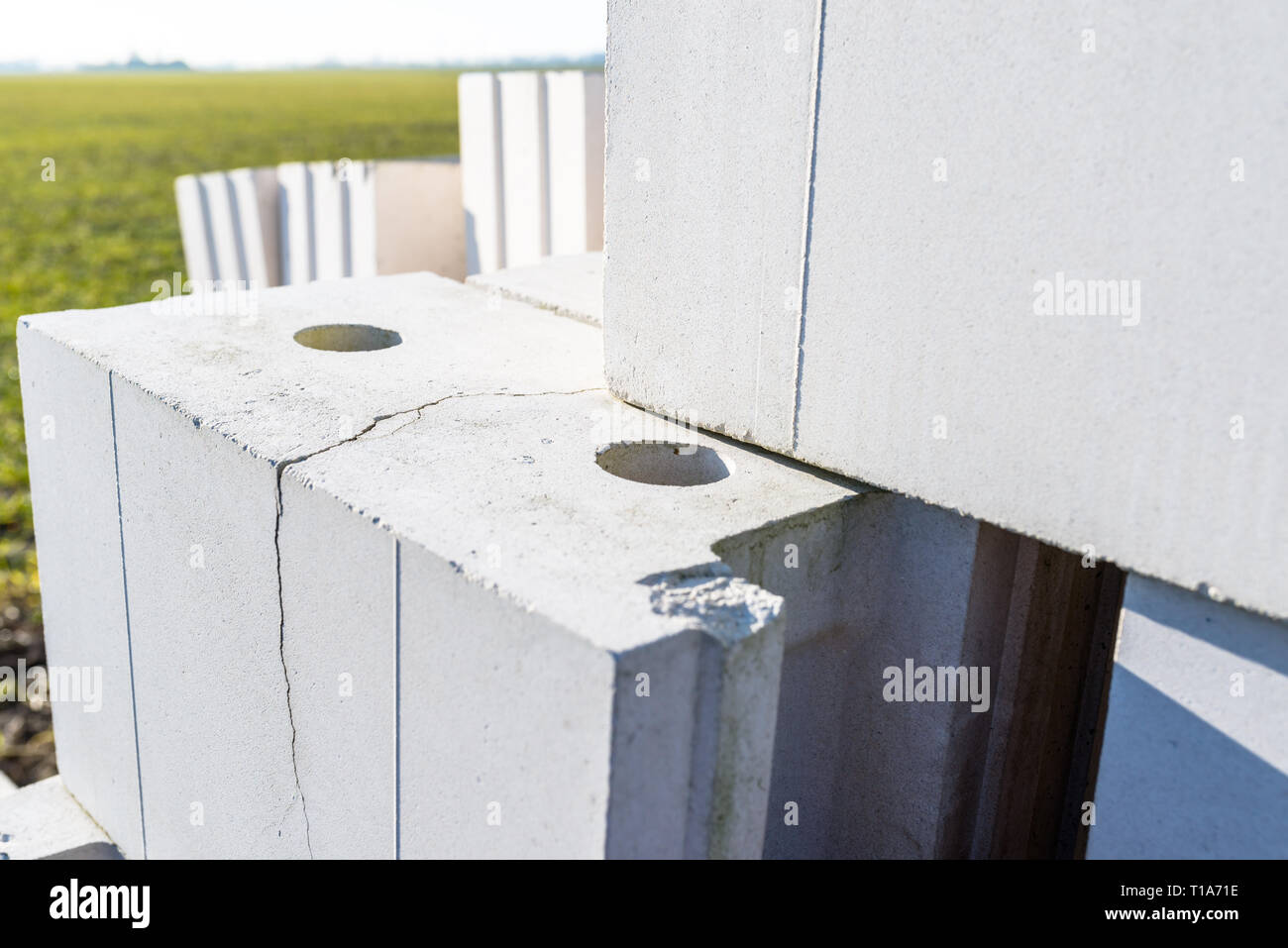Heap of bricks from cellular concrete, white bricks, hollow bricks with ...