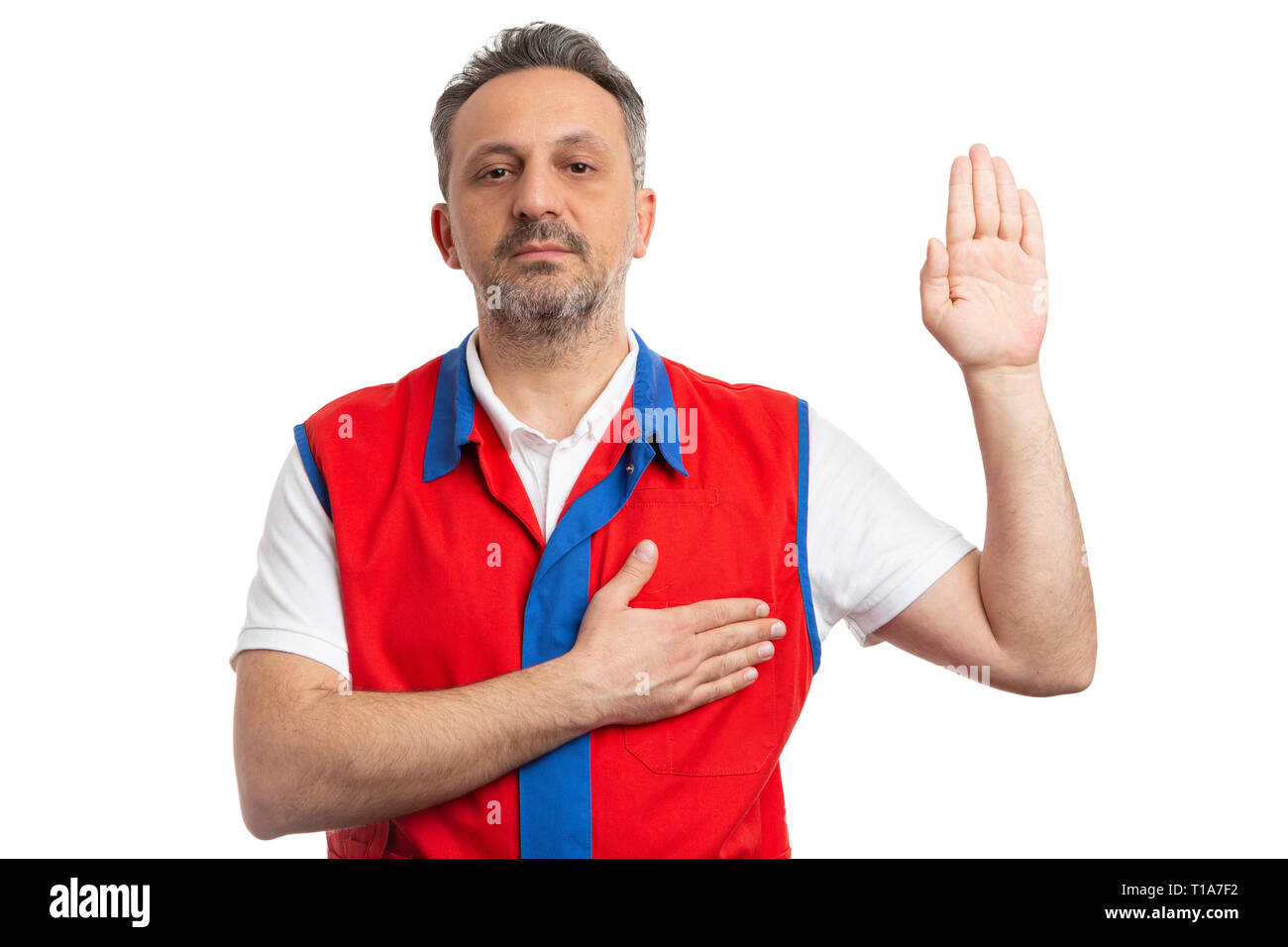 Oath gesture made with hand on heart and palm raised by male ...