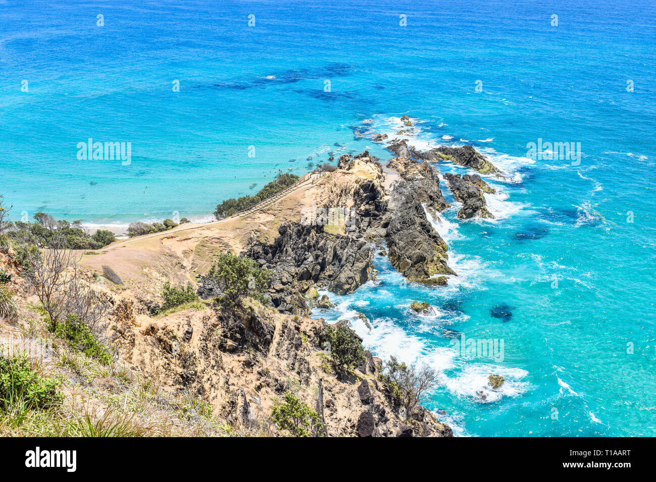 Geographic cape surrounded by the turquoise waters of Byron Bay ...