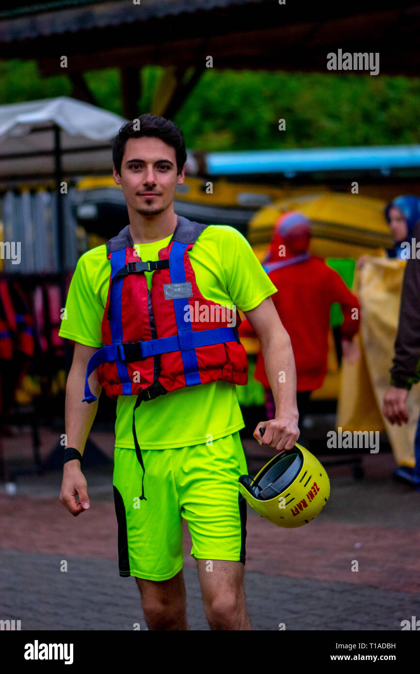 The man standing in the rafting suit after rafting on river Firtina ...