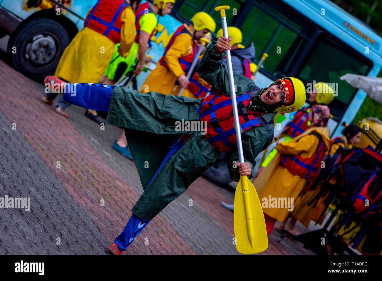 The girl standing in the rafting suit after rafting on river Firtina ...